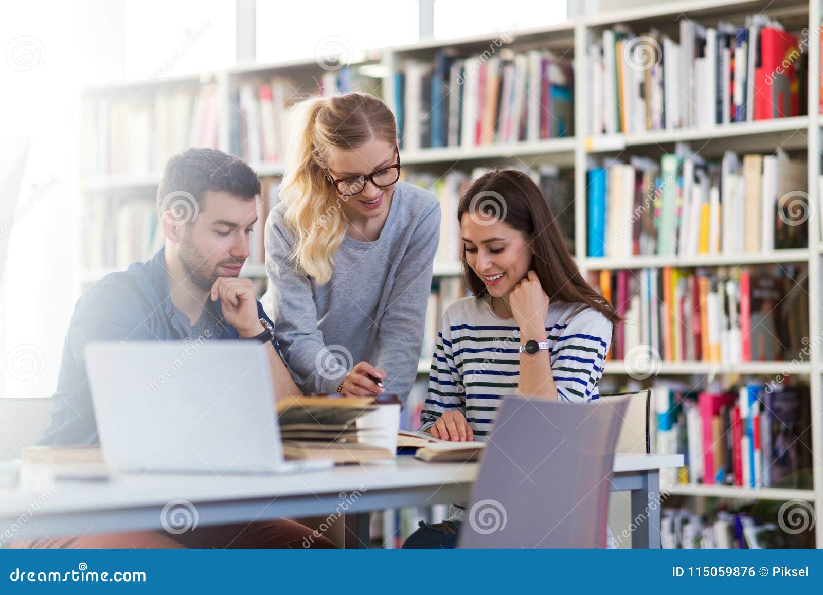 Students Working in the Library at Campus Stock Photo - Image of ...