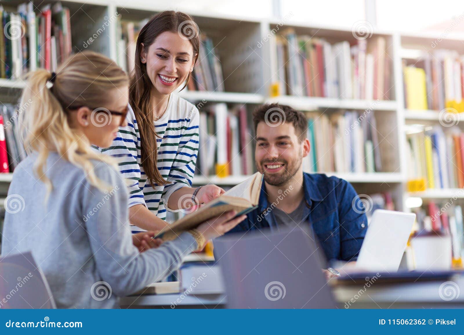 Students Working in the Library at Campus Stock Photo - Image of ...