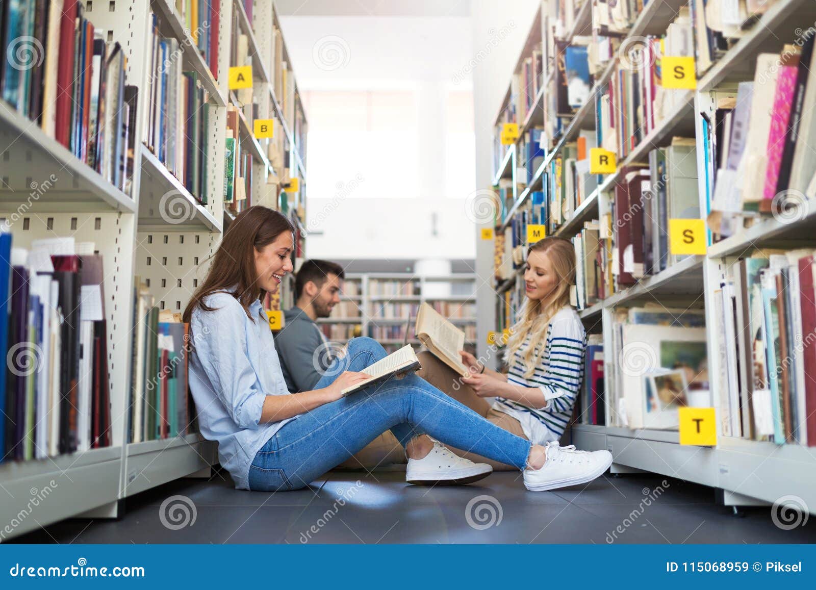 Students Working in the Library at Campus Stock Image - Image of ...