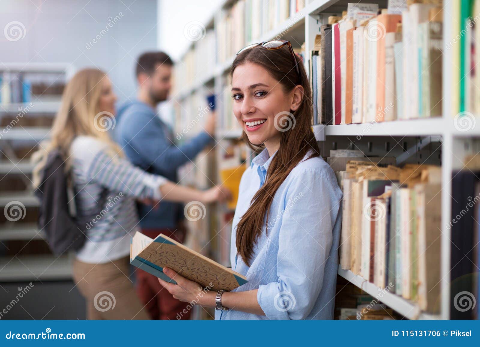 Students Working in the Library at Campus Stock Photo - Image of ...