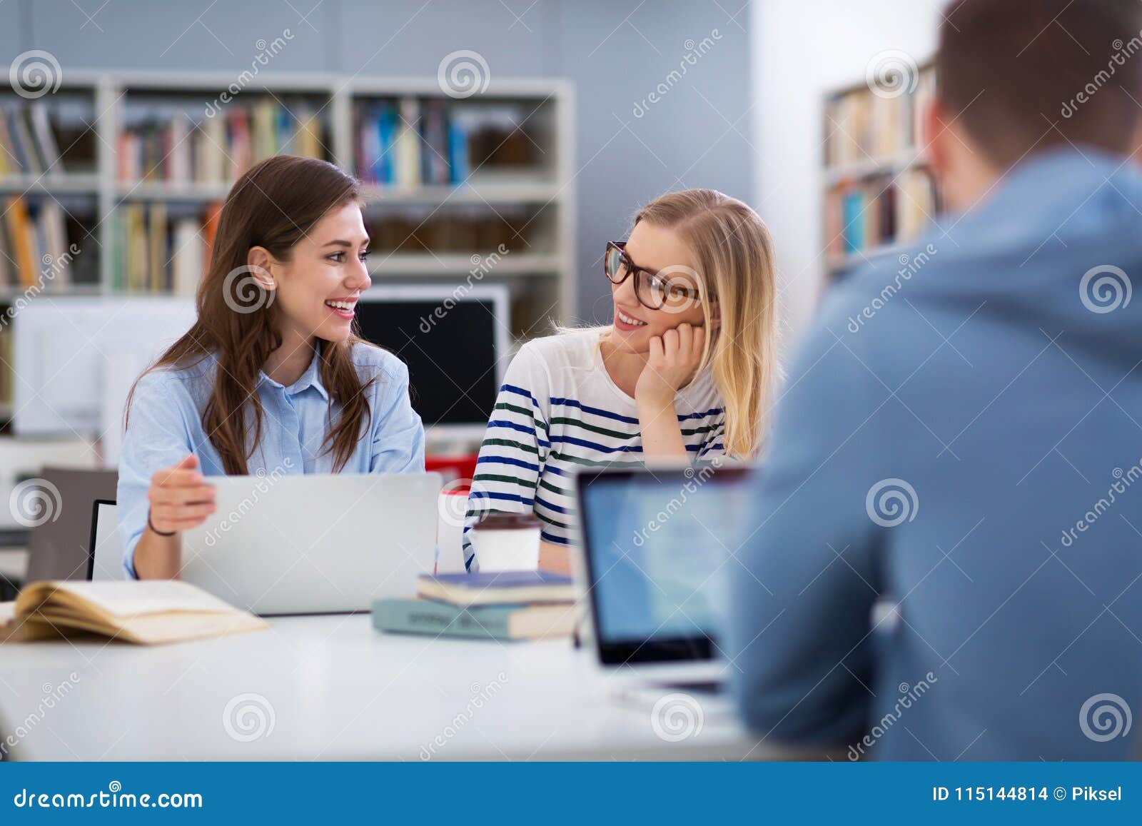 Students Working in the Library at Campus Stock Photo - Image of ...