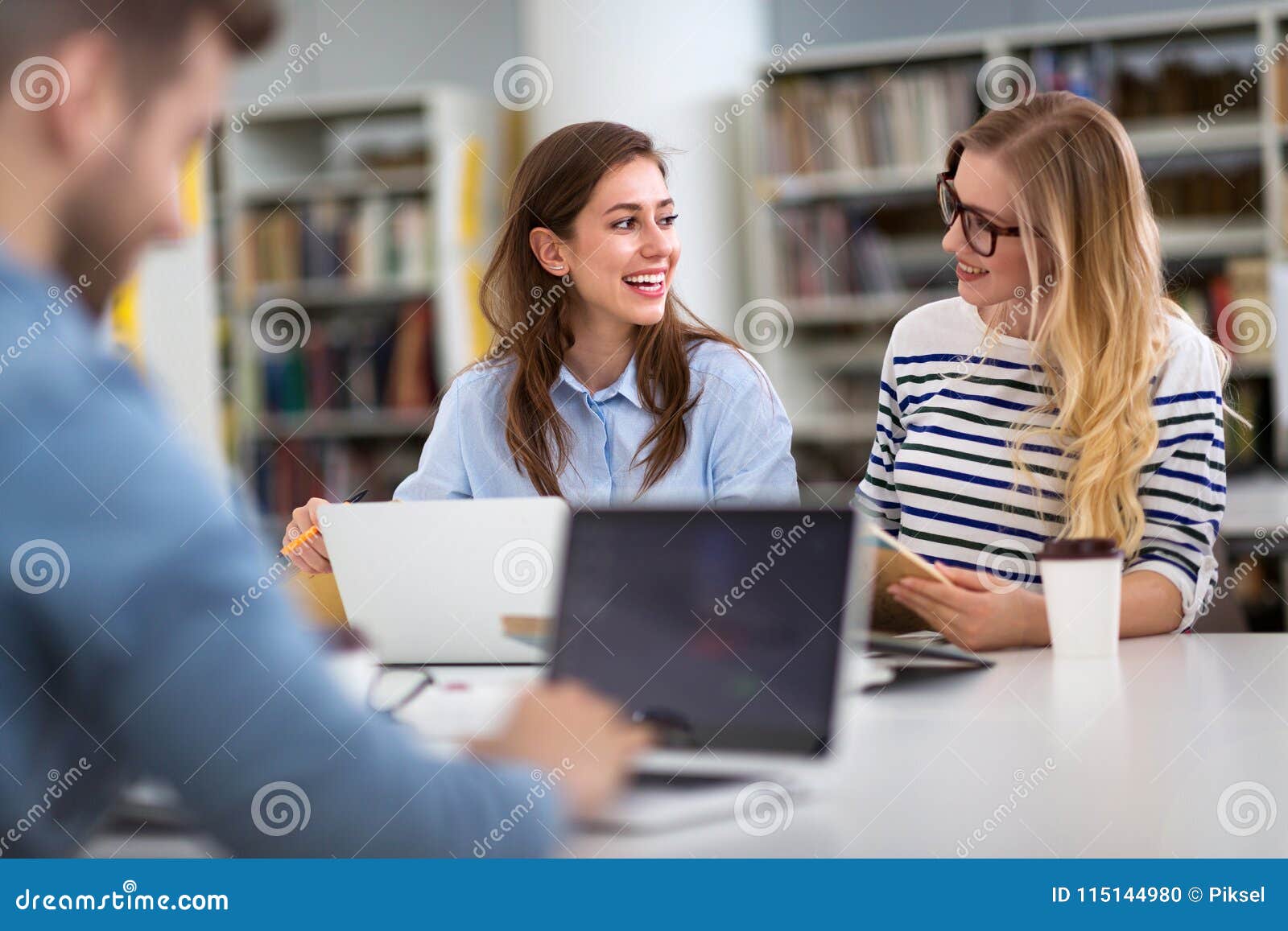 Students Working in the Library at Campus Stock Photo - Image of ...