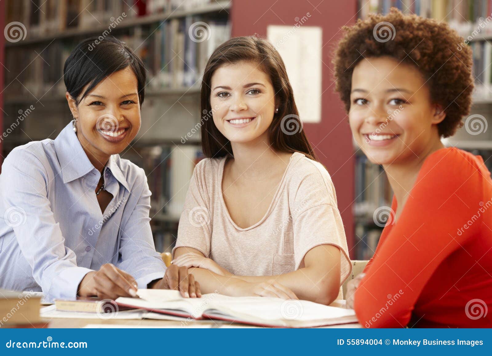 Students Working In The Library At Campus Stock Photo | CartoonDealer ...