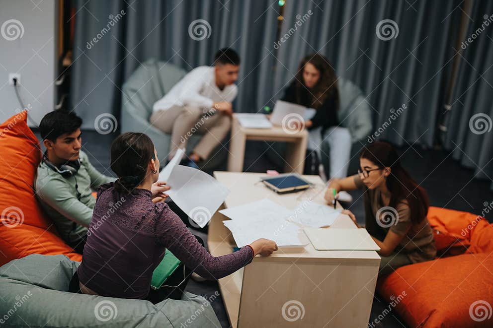 Group of Students Collaborating in a Casual Study Setting with Bean ...