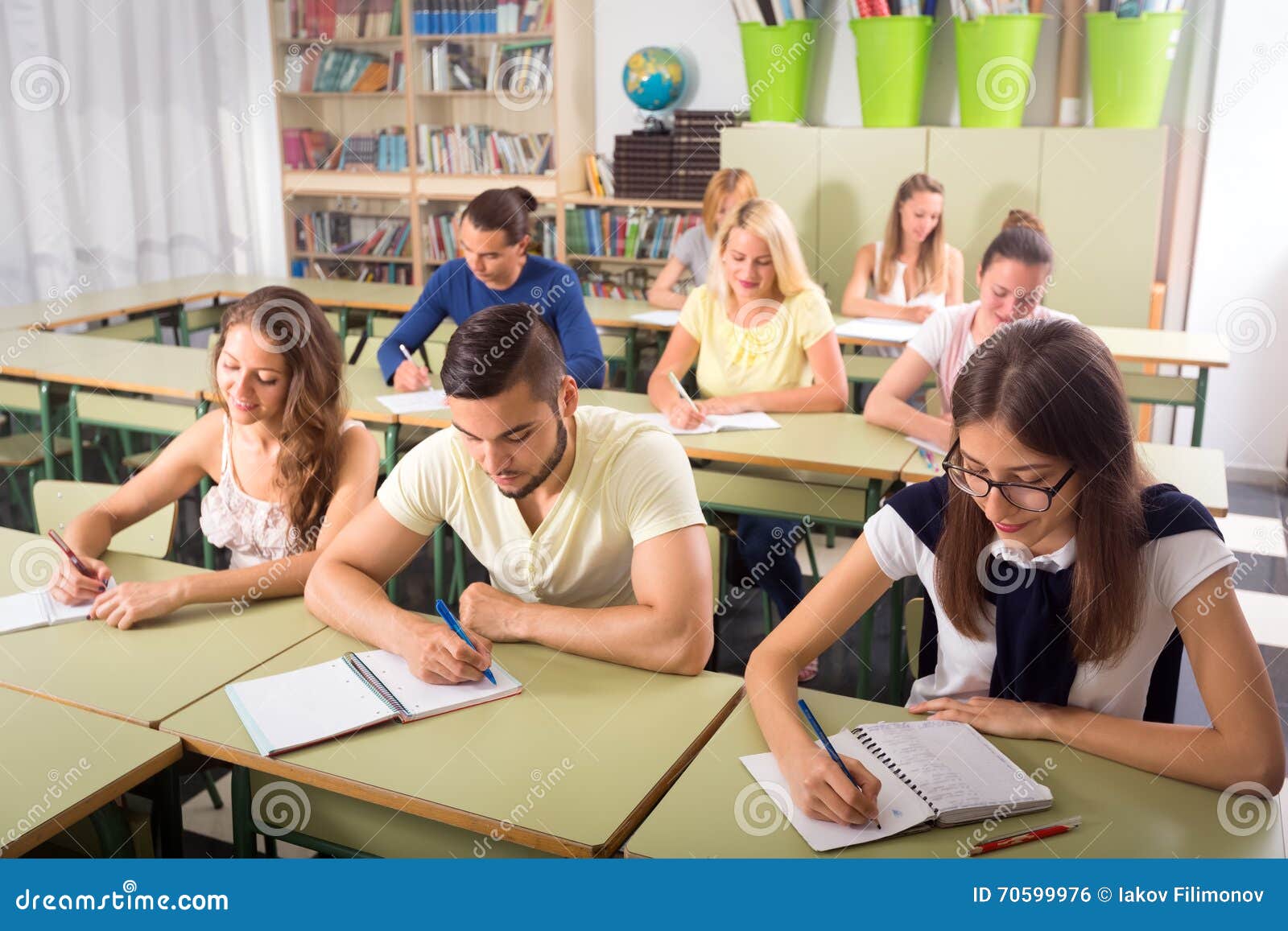 Students Writing in Copybooks Stock Photo - Image of american, mates ...