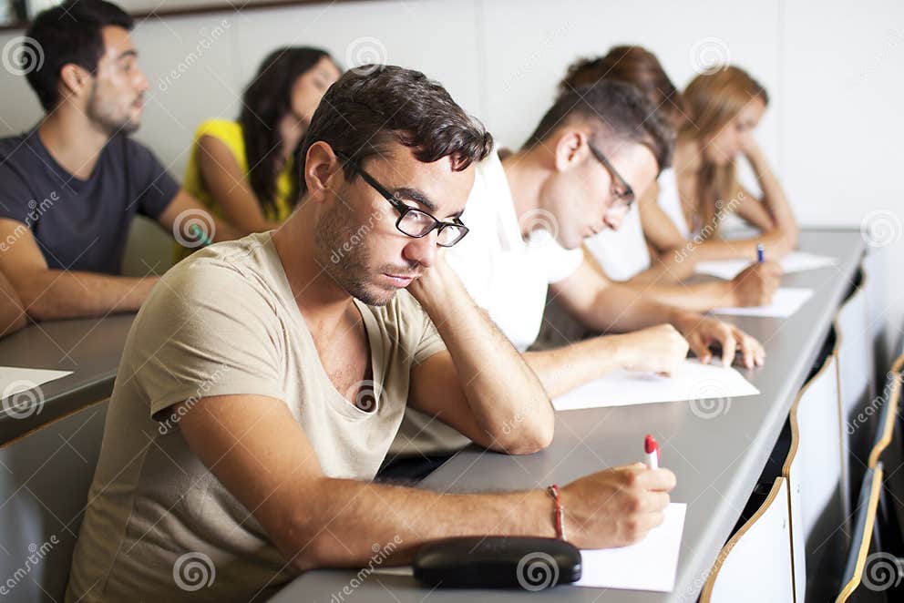 Students Writing an Exam in Class Room Stock Image - Image of people ...