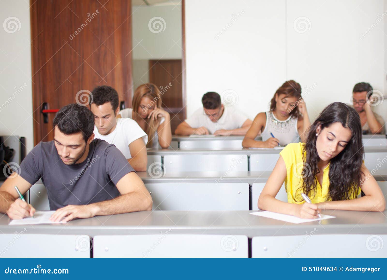 Students writing exam stock photo. Image of break, shirt - 51049634