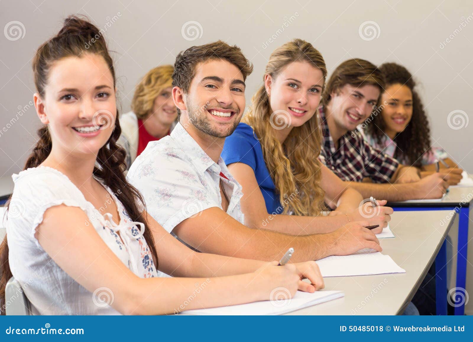 Students Writing Notes in Classroom Stock Photo - Image of classmates ...