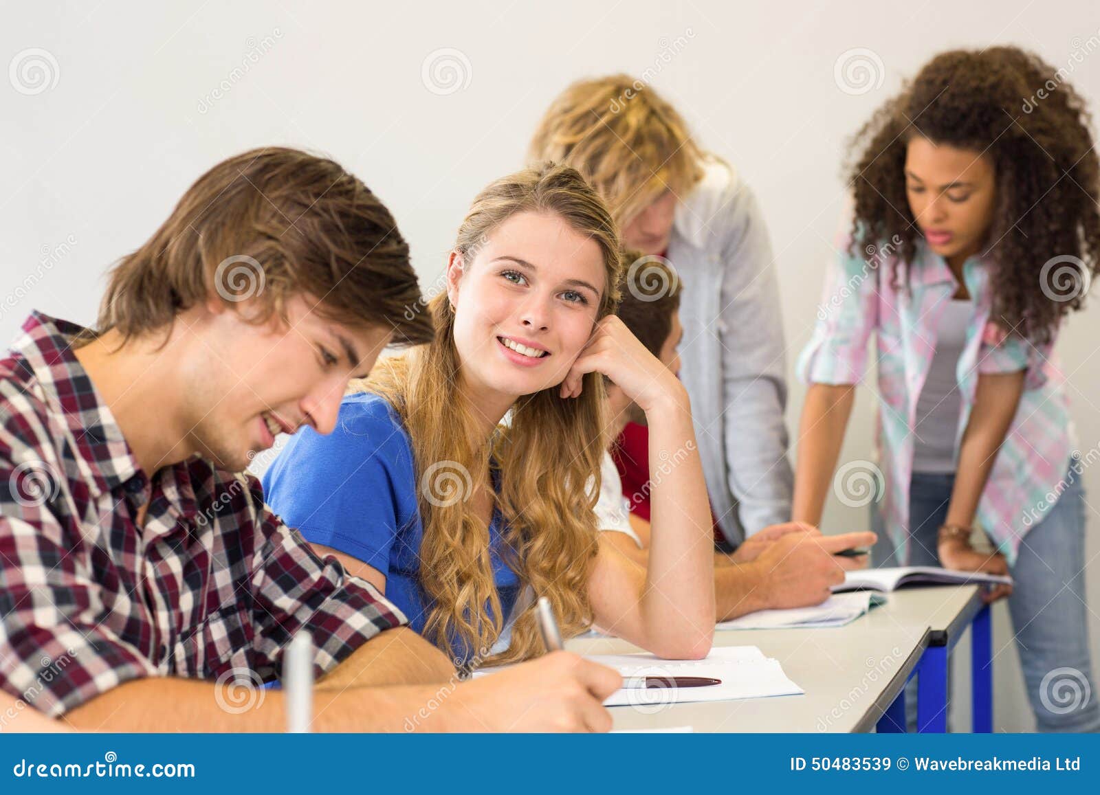 Students Writing Notes in Classroom Stock Image - Image of notes ...