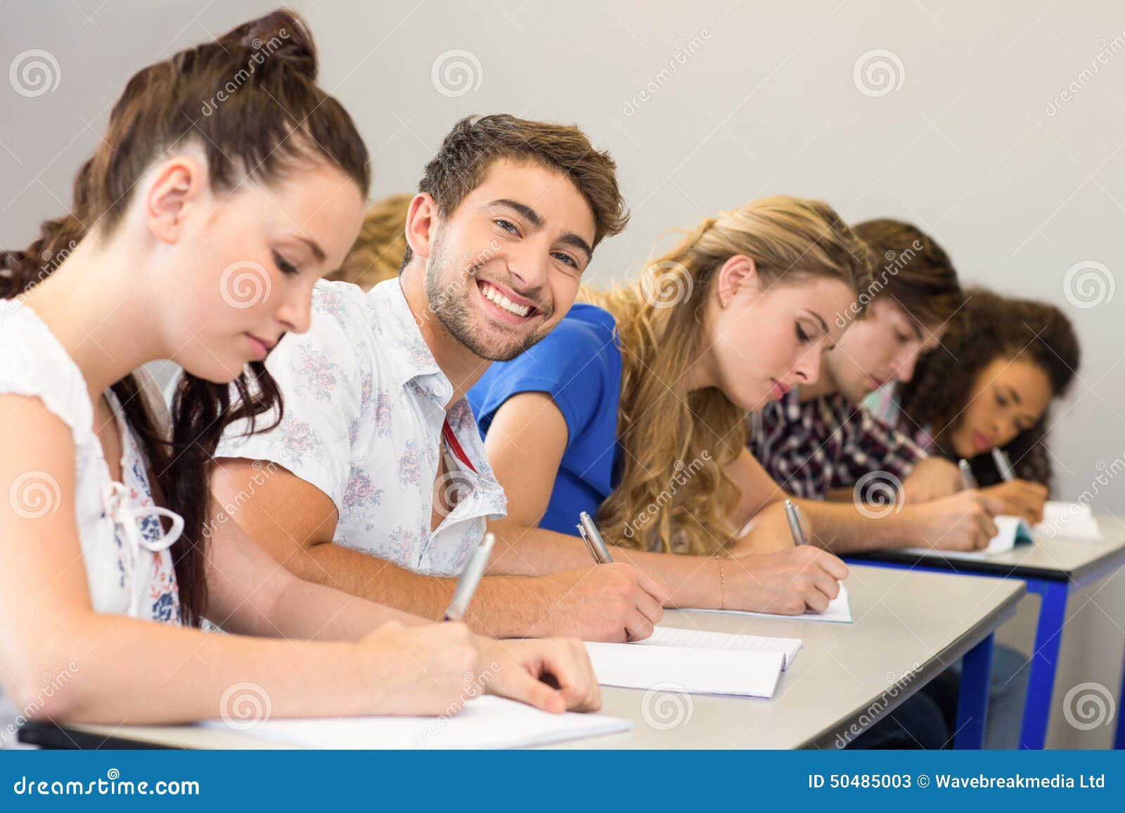 Students Writing Notes in Classroom Stock Image - Image of learning ...