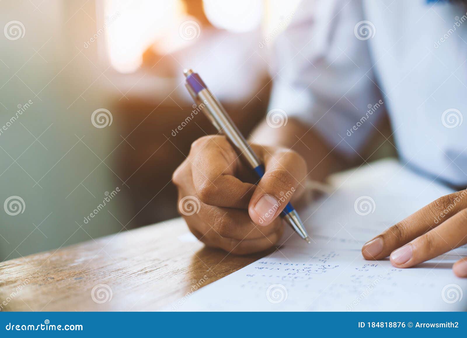 Students Writing Pen in Hand Doing Exams Answer Sheets Exercises in ...