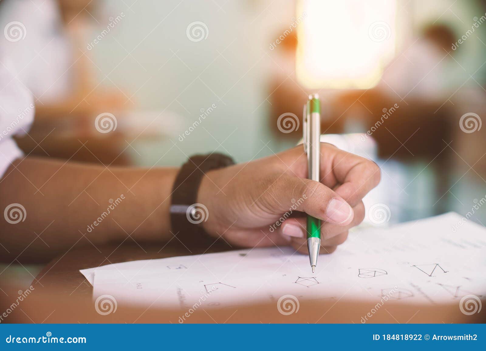 Students Writing Pen in Hand Doing Exams Answer Sheets Exercises in ...