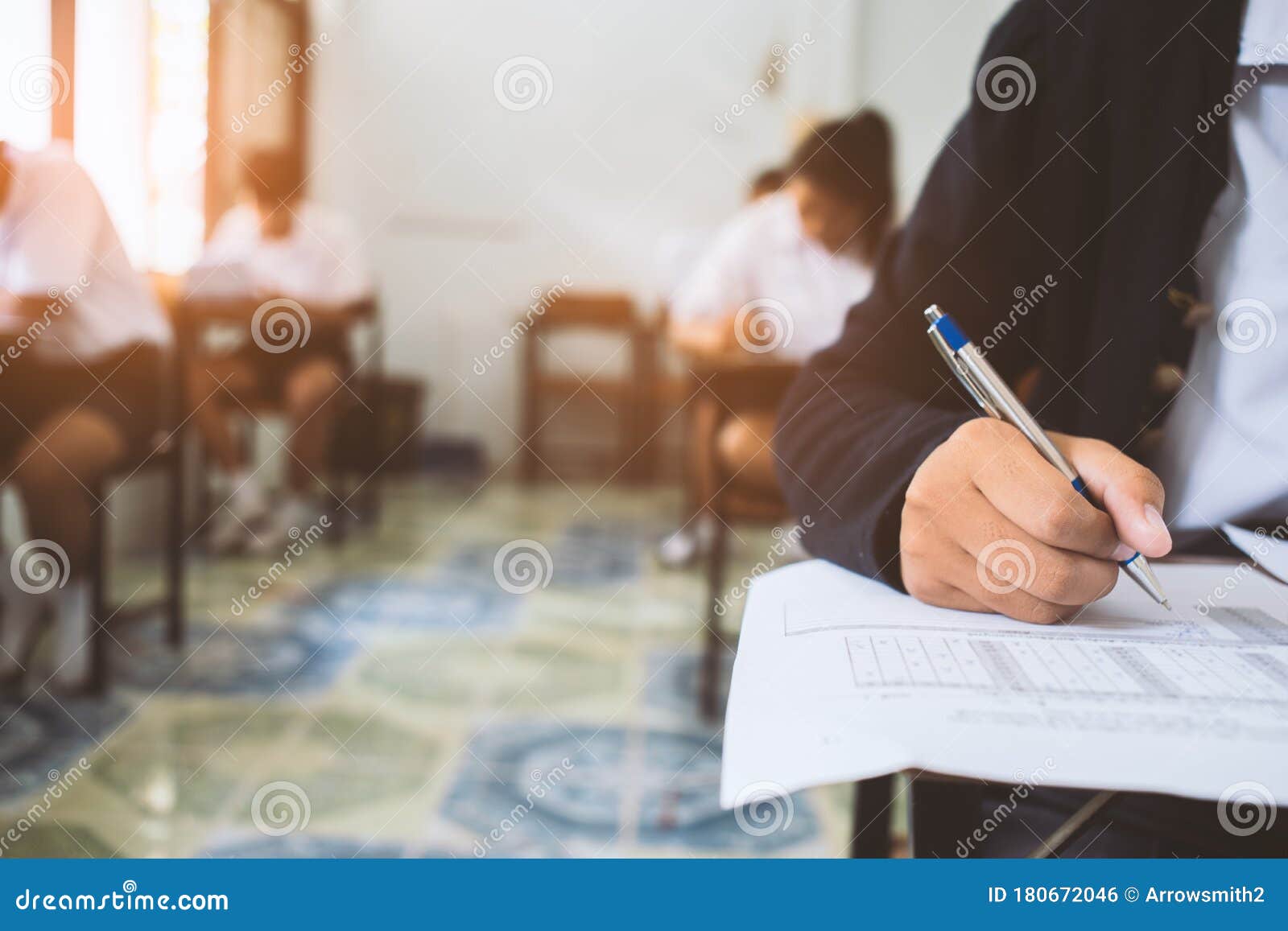 Students Writing and Reading Exam Answer Sheets Exercises in Classroom ...