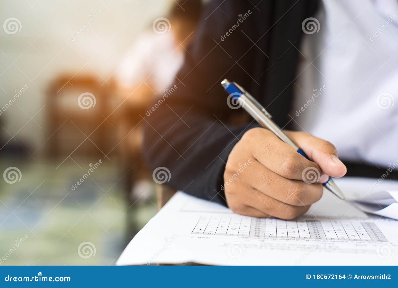 Students Writing and Reading Exam Answer Sheets Exercises in Classroom ...