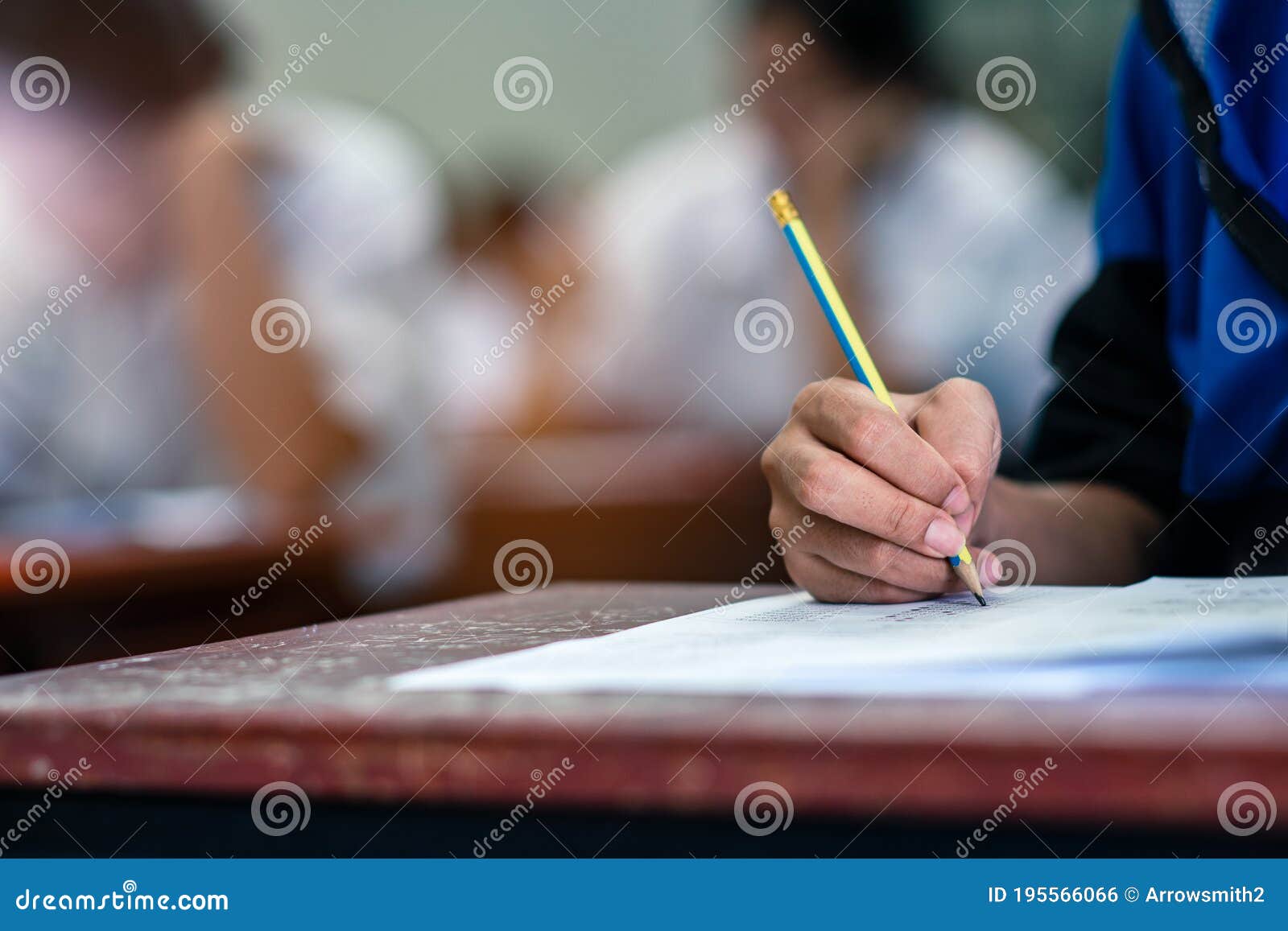 Students Writing and Reading Exam Answer Sheets Exercises in Classroom ...
