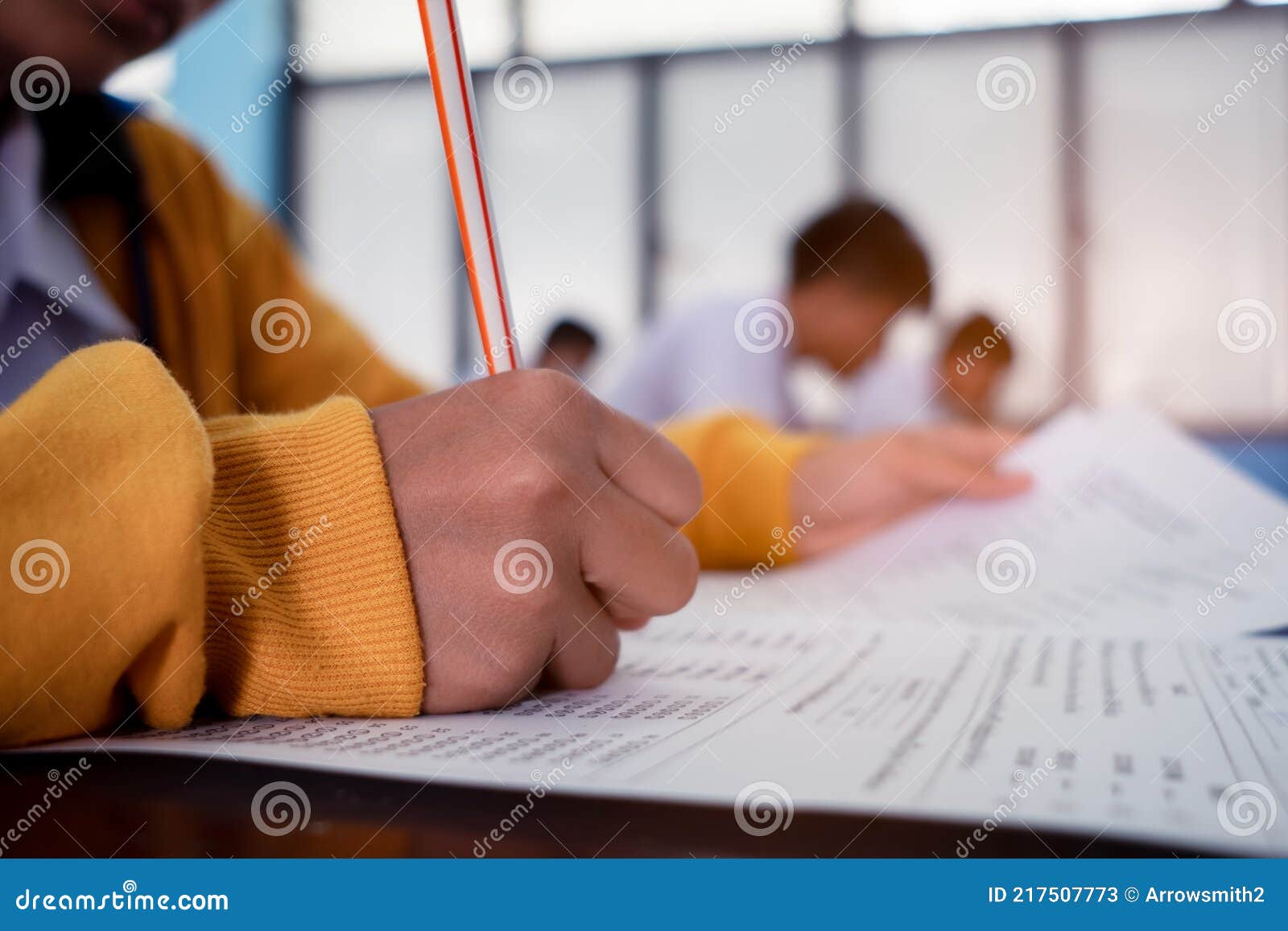 Students Writing and Reading Exam Answer Sheets Exercises in Classroom ...