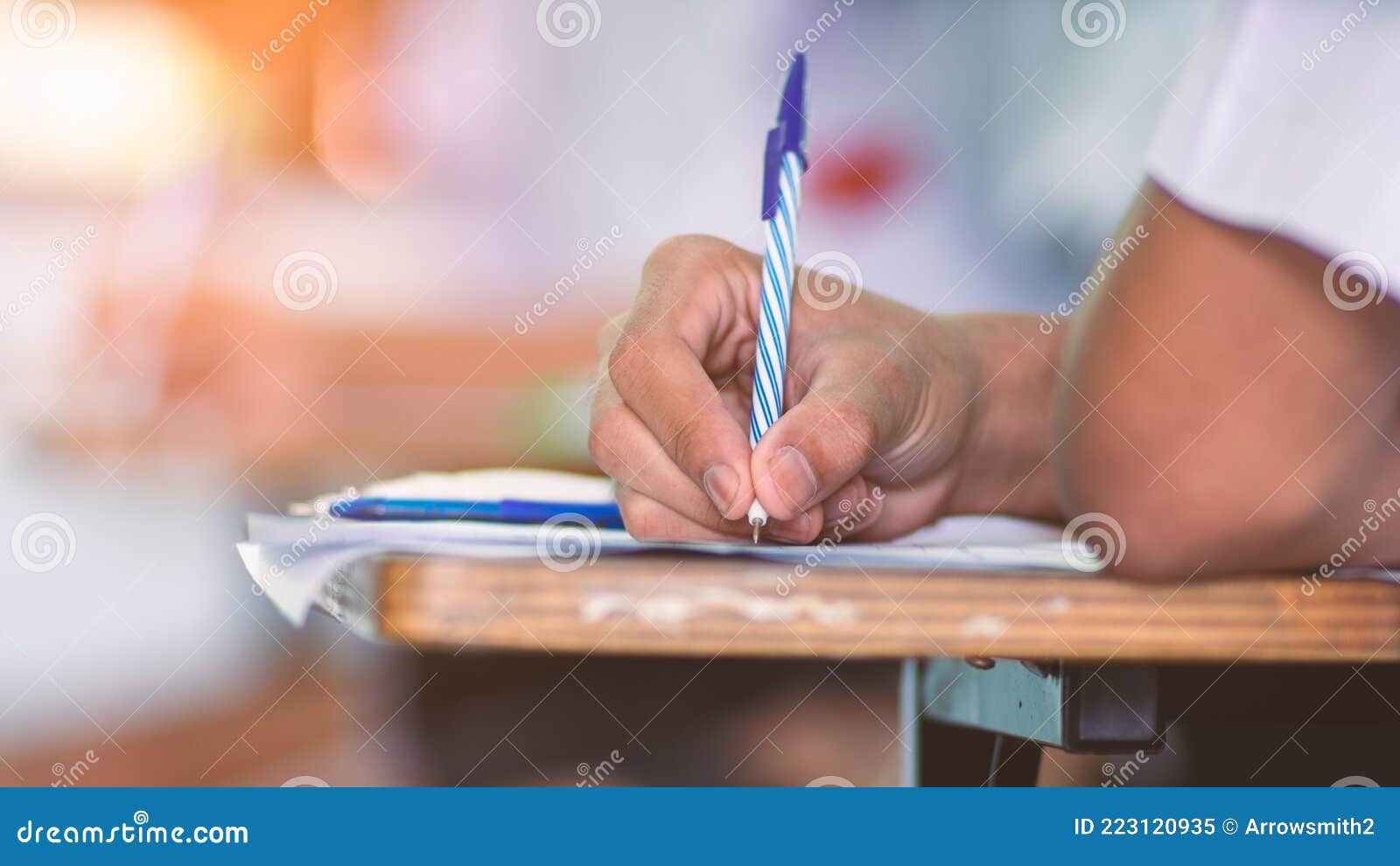 Students Writing And Reading Exam Answer Sheets Exercises In Classroom ...