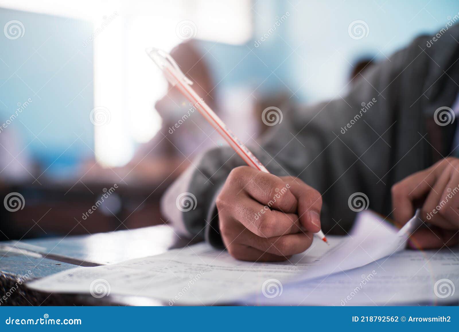 Students Writing and Reading Exam Answer Sheets Exercises in Classroom ...
