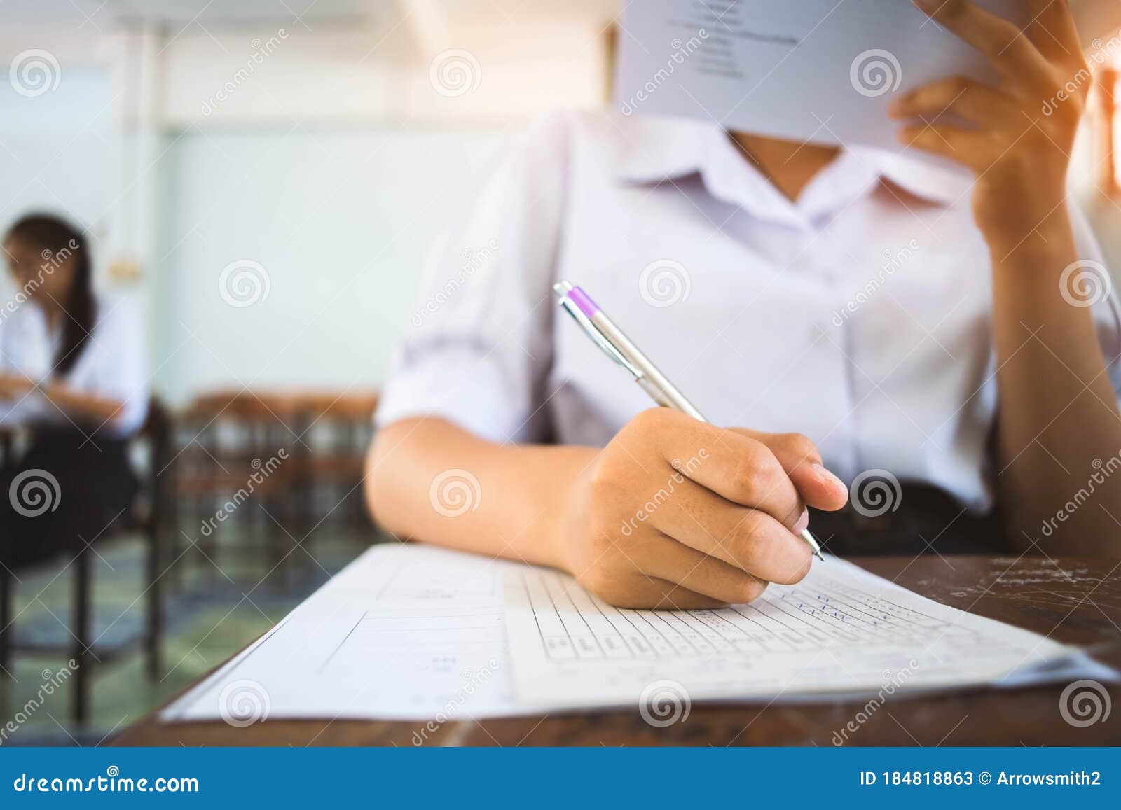 Students Writing and Reading Exams Answer Sheets Exercises in Classroom ...