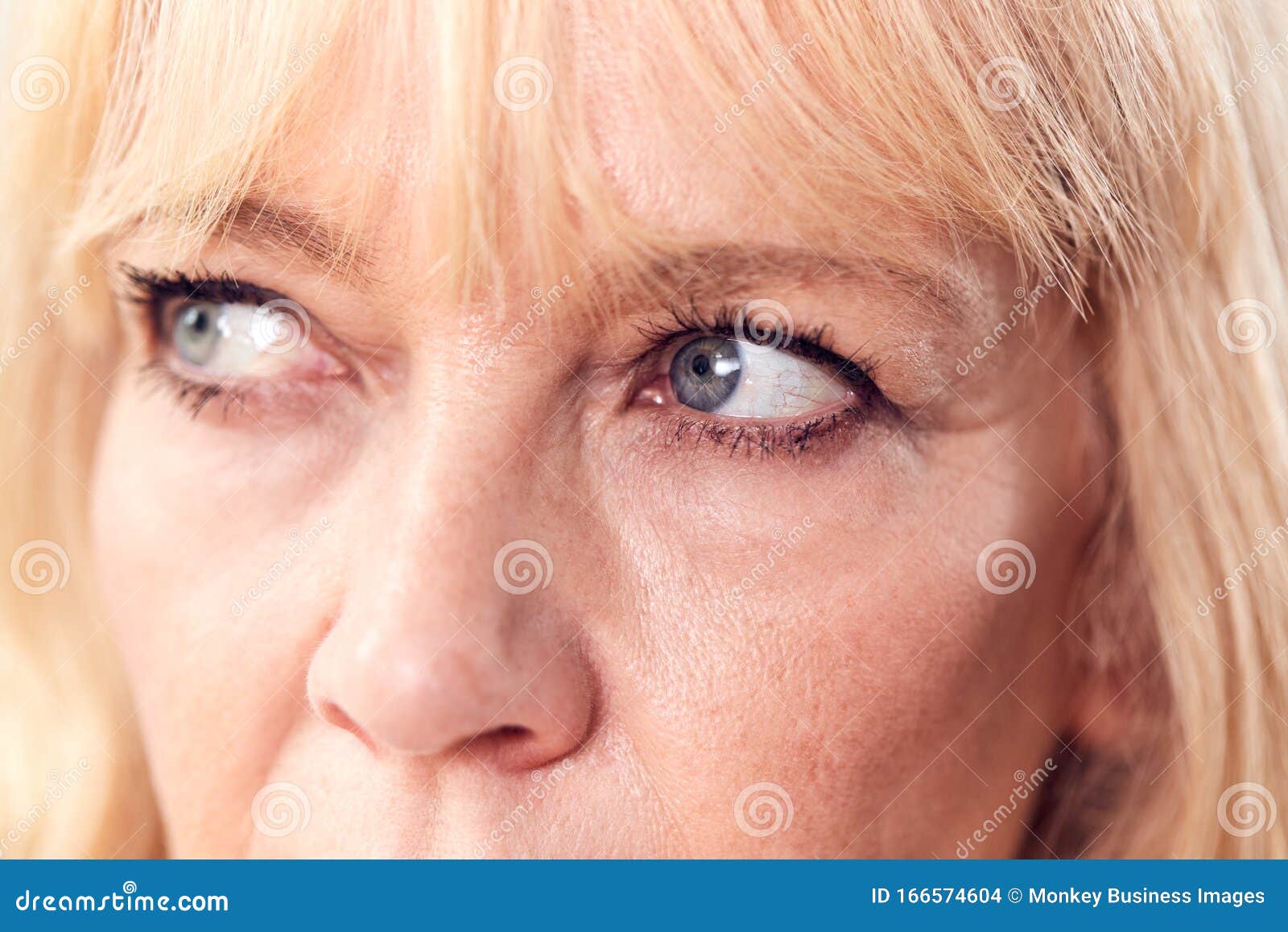 Studio Close Up of Mature Woman Looking Suspicious and Distrustful ...