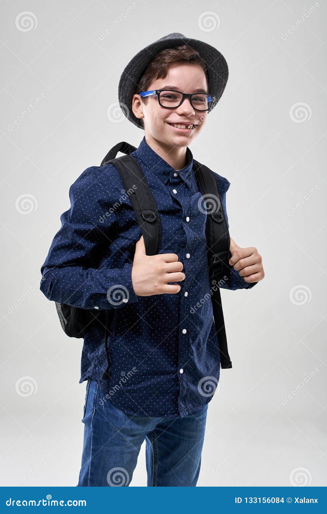 Schoolboy with backpack stock photo. Image of fashion - 133156084