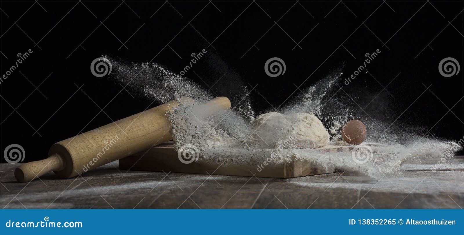 Studio Photo of a Ball of Bread Dough Falling on Flour with Roller ...