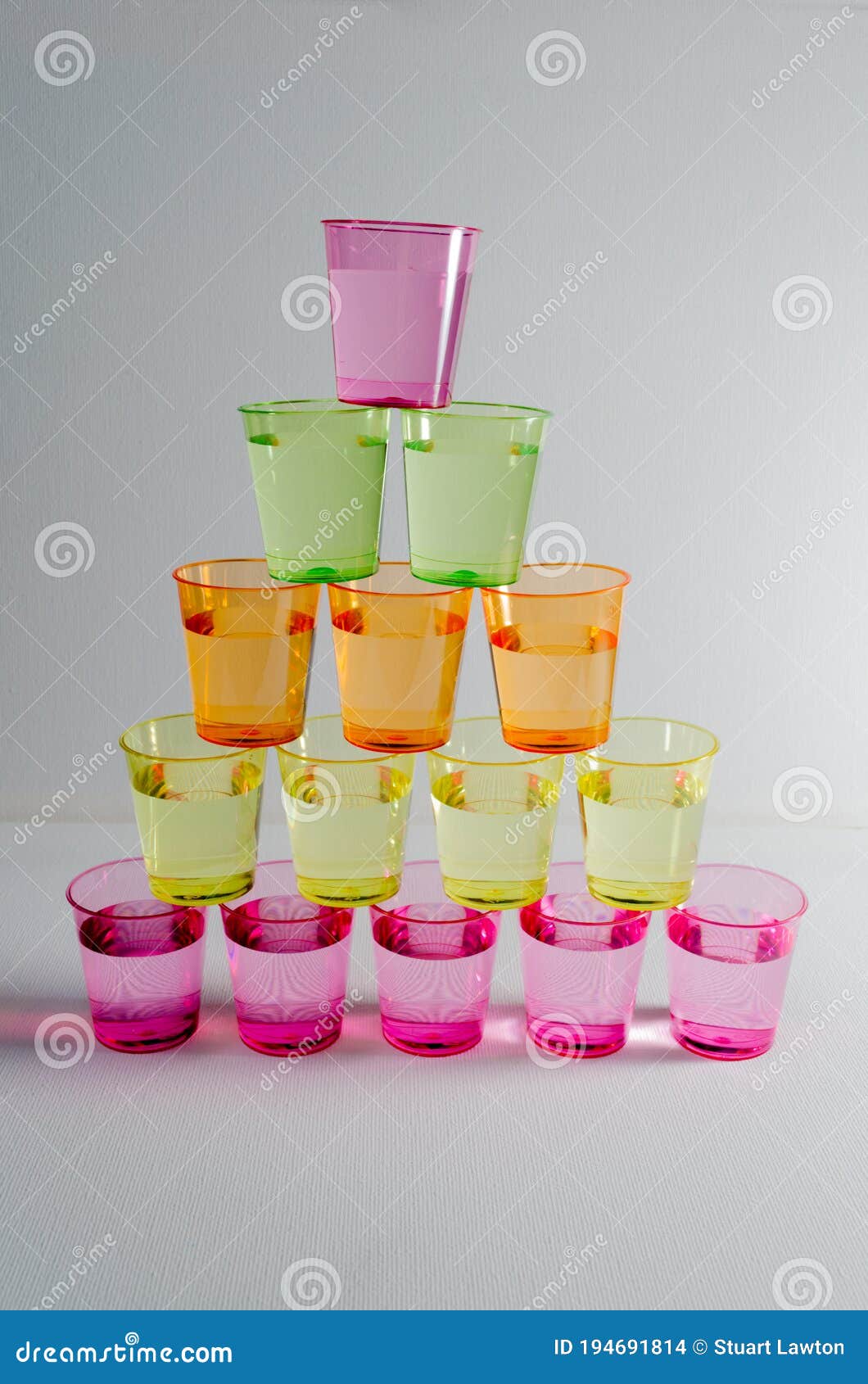 A Studio Photograph of Multicoloured `Shot` Containers in a Pyramid ...