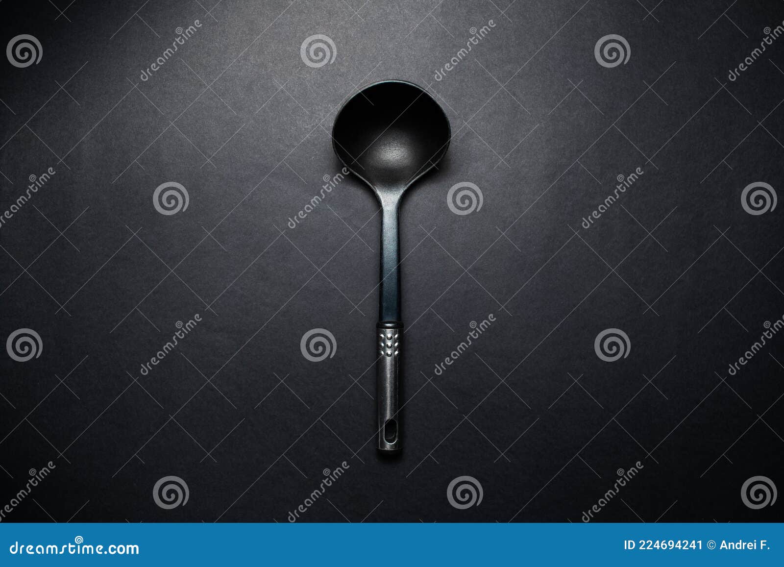 Studio Picture of Big Black Plastic Dipper with Chromed Handle Stock ...