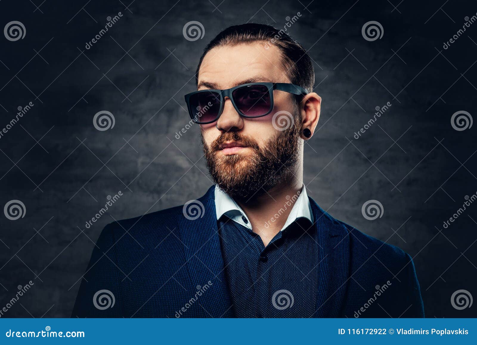 Portrait Of Bearded Male In Sunglasses And Piercing In A Nose Stock