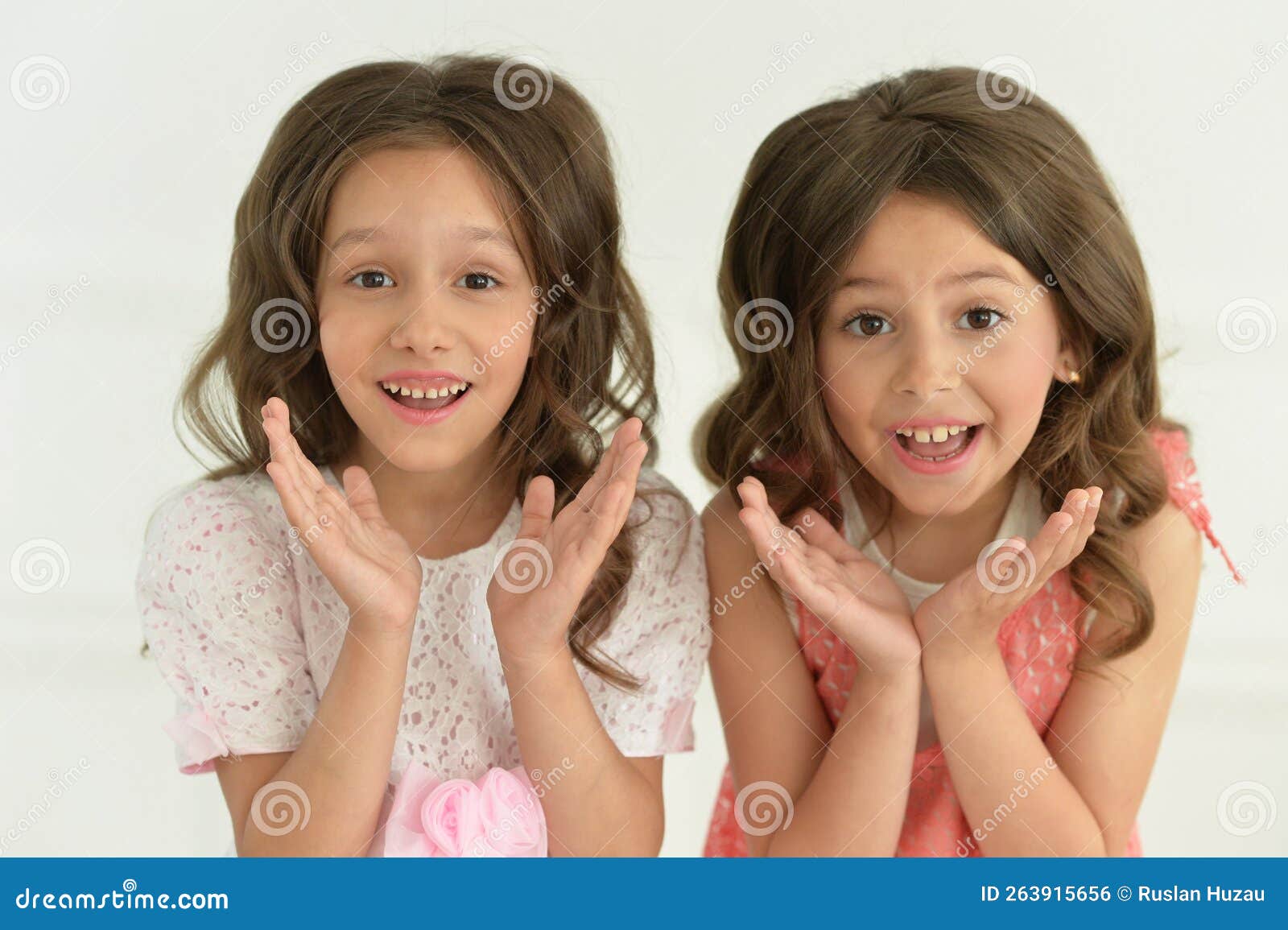Studio Portrait of Cute Twin Sisters Posing Stock Photo - Image of ...