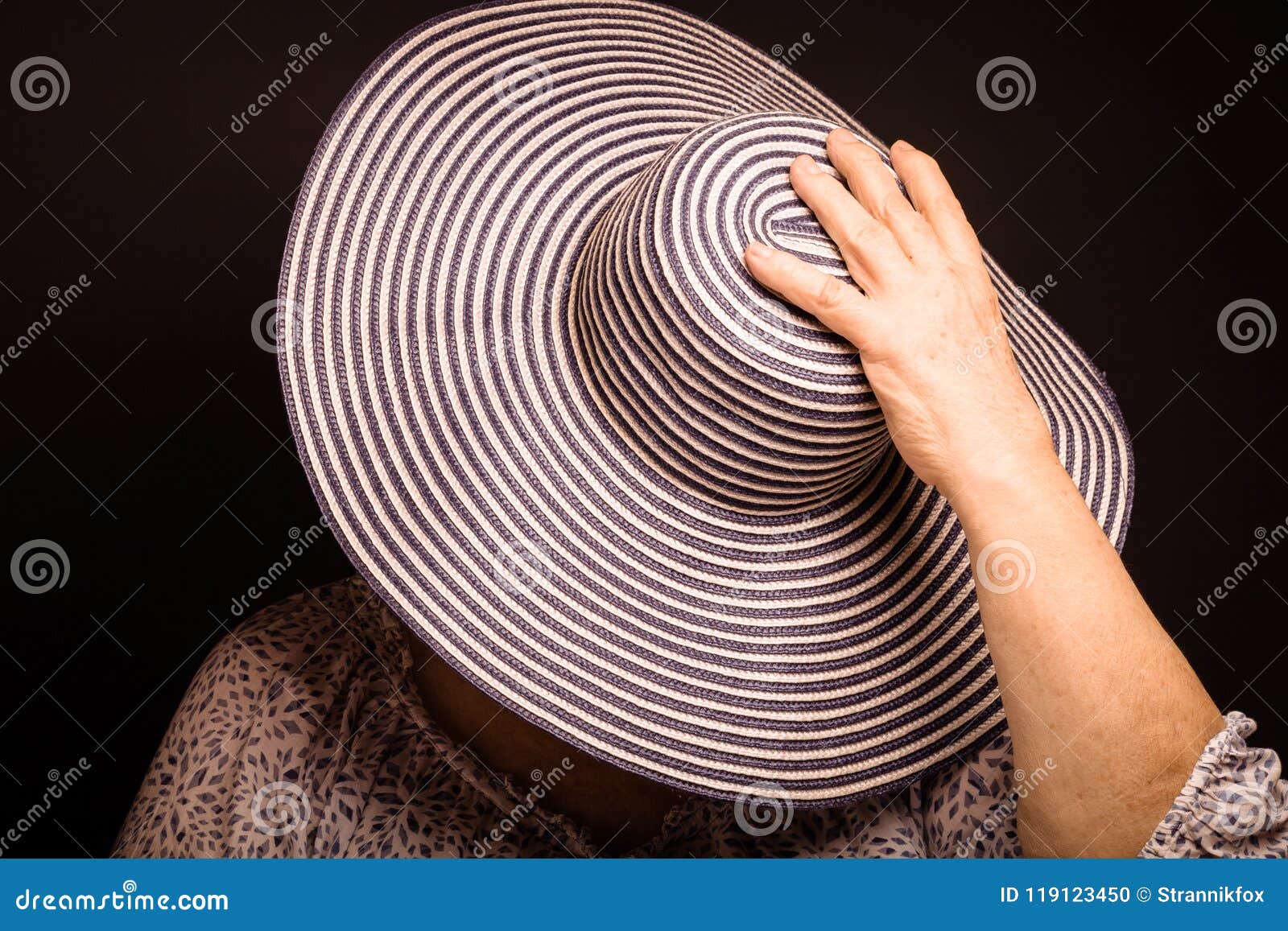 Studio Portrait of Elderly Woman. Face Hidden by a Hat Stock Photo ...