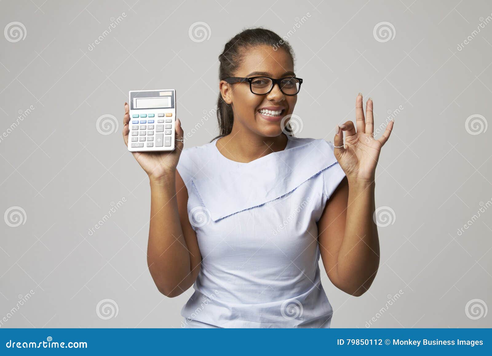 Studio Portrait of Female Accountant Using Calculator Stock Photo ...