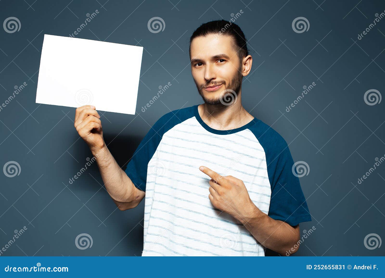 Studio Portrait of Guy Point Finger on White Empty Paper Board. Blue ...