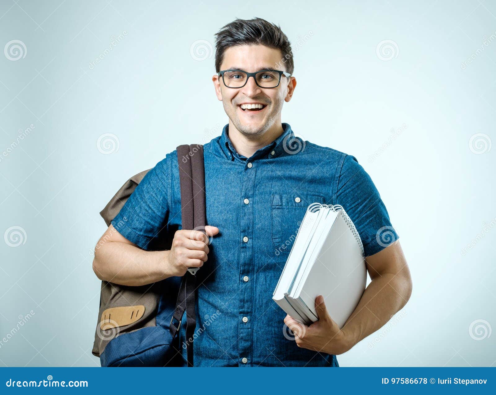 Studio Portrait of Handsome Young Man with Backpack Stock Photo - Image ...