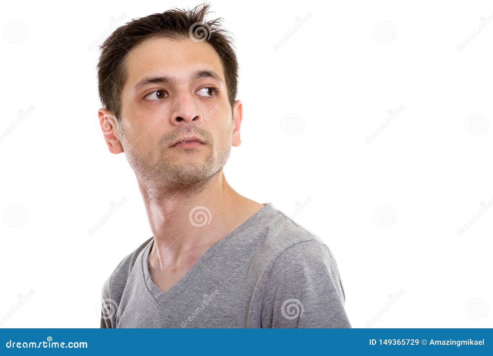 Studio Shot of Young Man Looking Back while Thinking Stock Image ...