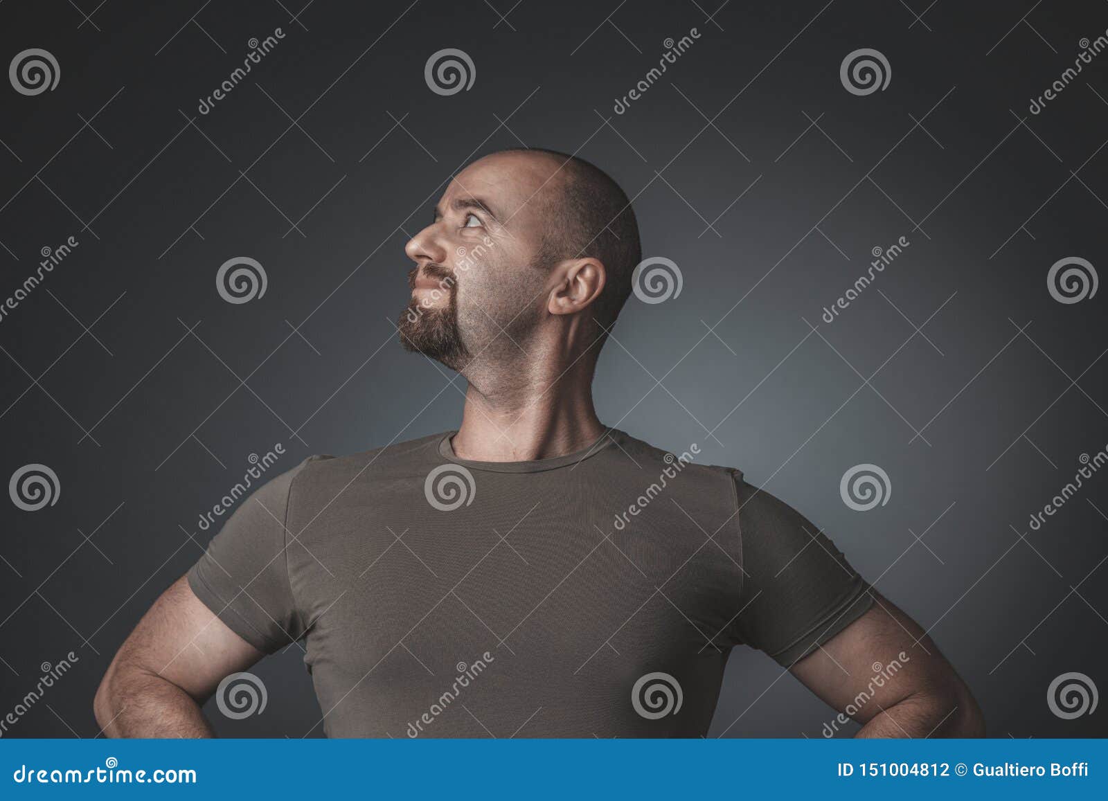 Studio Portrait of a Man with a Satisfied and Proud Expression, Side ... Studio Portrait of a Man with a Satisfied and Proud Expression, Side ...