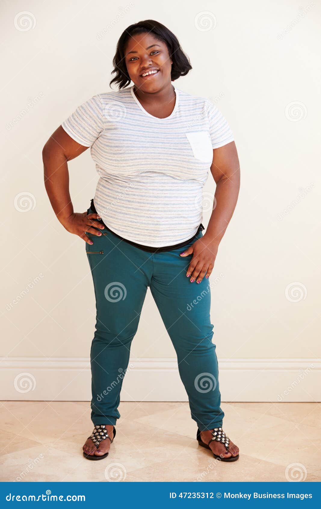 Studio Portrait of Smiling Overweight Woman Stock Photo - Image of ...