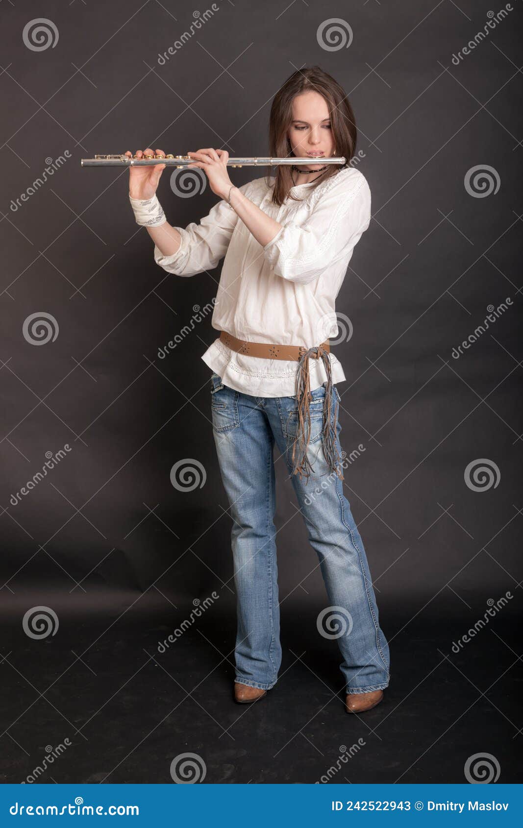 Woman playing the flute stock image. Image of young - 242522943
