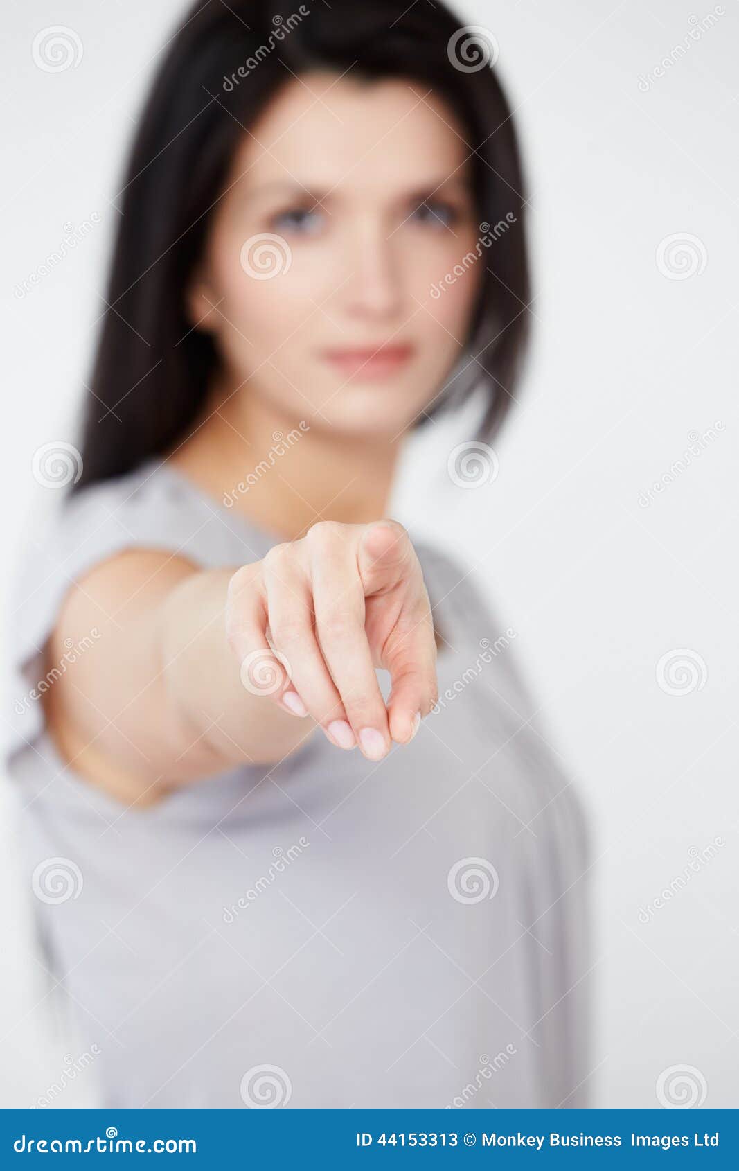 Studio Portrait of Woman Pointing at Camera Stock Image - Image of ...