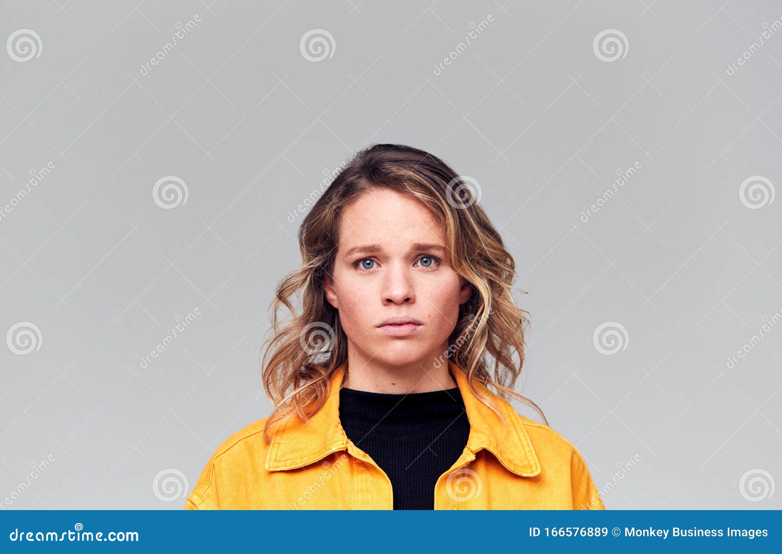 Studio Portrait of Worried Young Woman Looking at Camera Stock Image ...