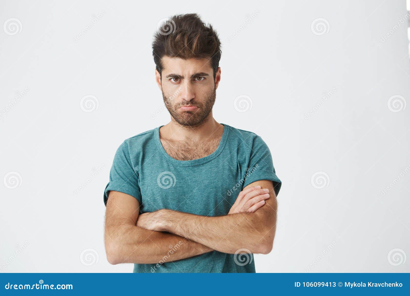 Studio Shot of Angry Grumpy Young Male Dressed Casually Keeping Arms ...