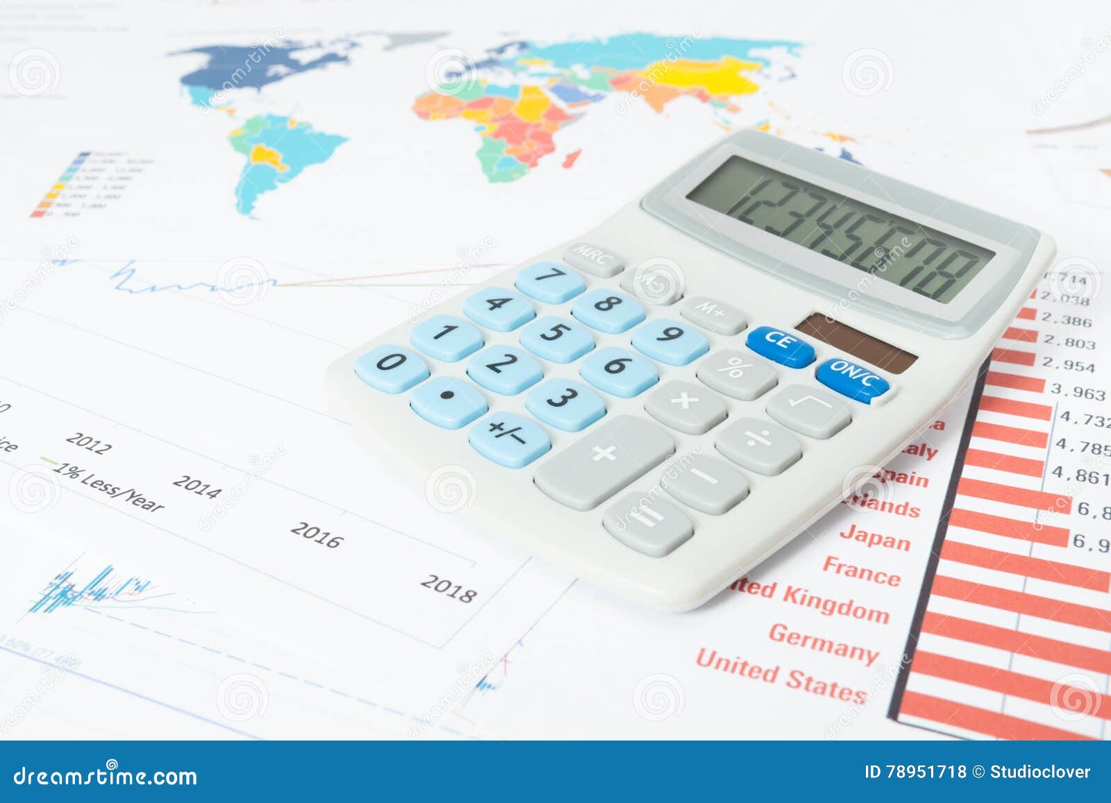 Studio Shot of Data Charts and Graphs with Calculator Over it Stock ...