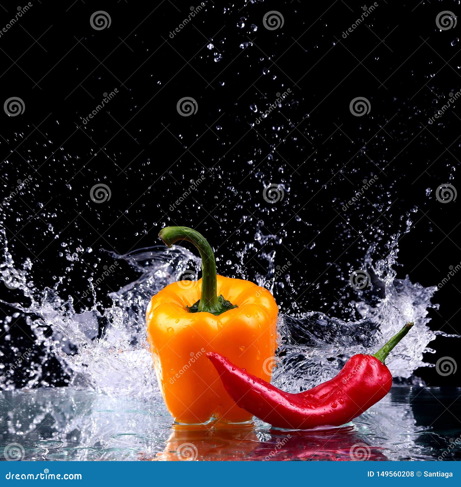 Studio Shot with Freeze Motion of Peppers in Water Splash on Black ...