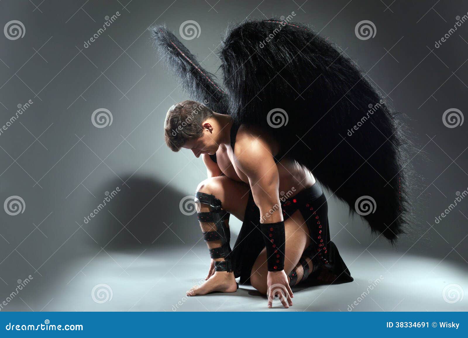 Studio Shot of Handsome Man Posing As Fallen Angel Stock Image - Image ...