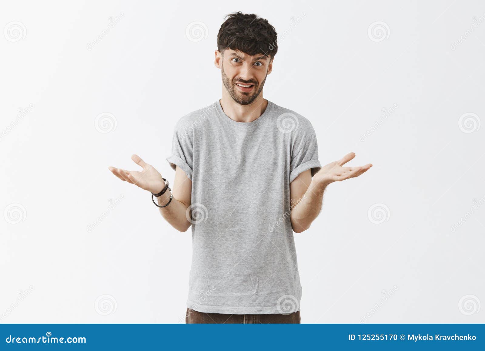 Studio Shot of Man Explaining Something Simple Being Questioned Someone ...