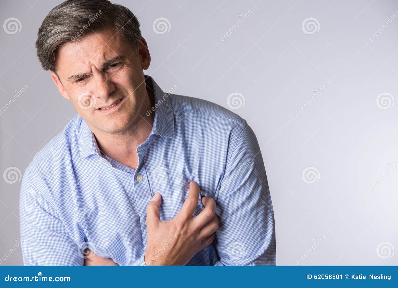 Studio Shot of Mature Man Suffering Heart Attack Stock Image - Image of ...