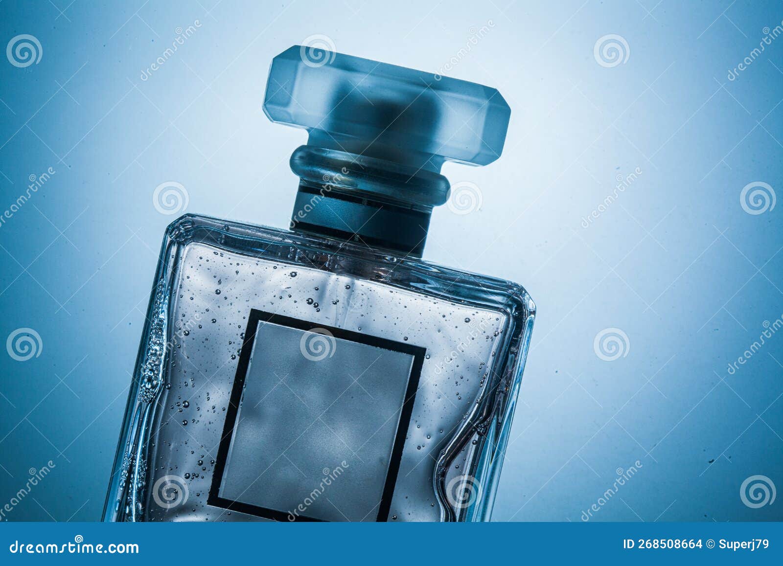 Backlit Perfume Bottle Shot in Studio Stock Photo - Image of liquid ...