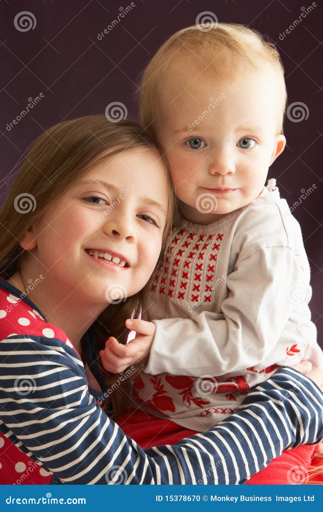 Studio Shot of Two Sisters Hugging Stock Photo - Image of smiling ...