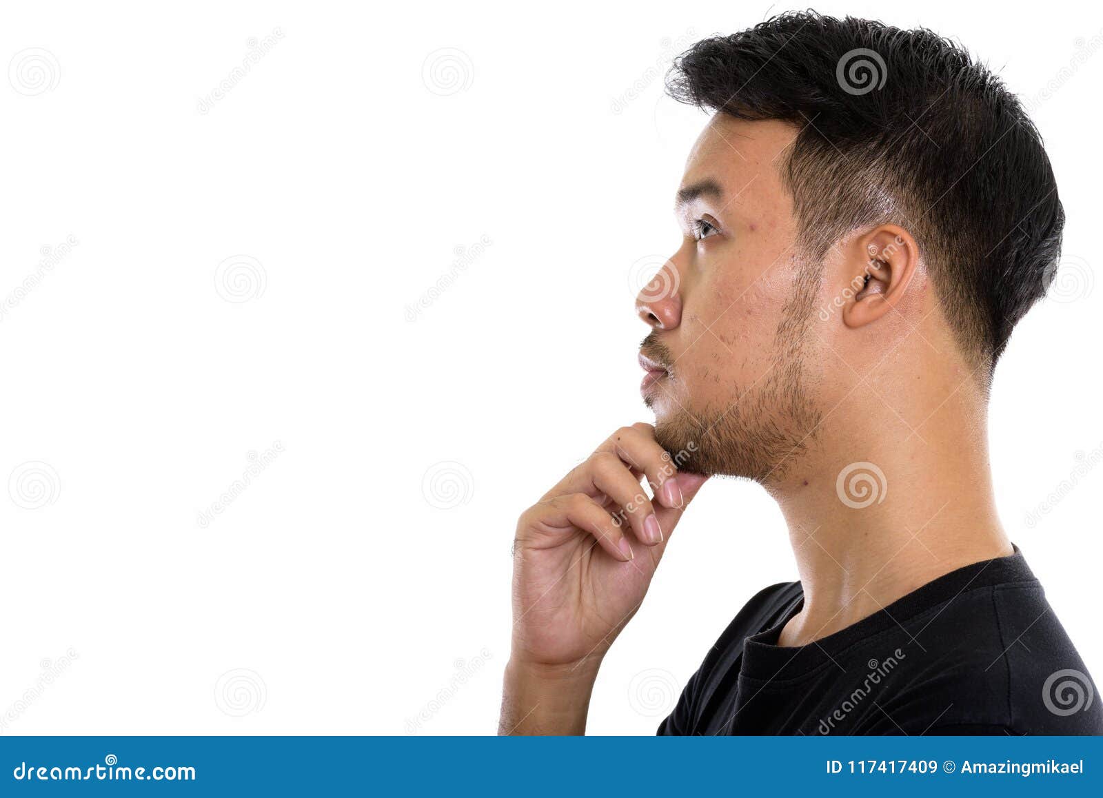 Profile View of Young Asian Man Thinking while Looking Up Stock Image ...