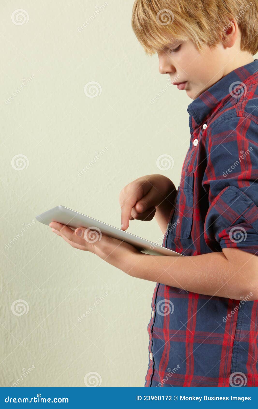 Studio Shot of Young Boy Holding Tablet Computer Stock Photo - Image of ...